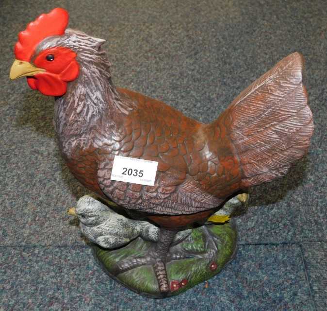 Lot 2030 - A pottery chicken with chicks, 31cm high.