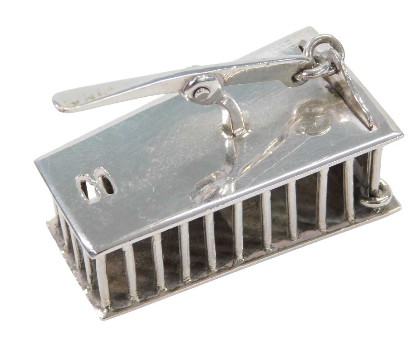 Lot 28 - A Dutch silver miniature of a rat trap, assay