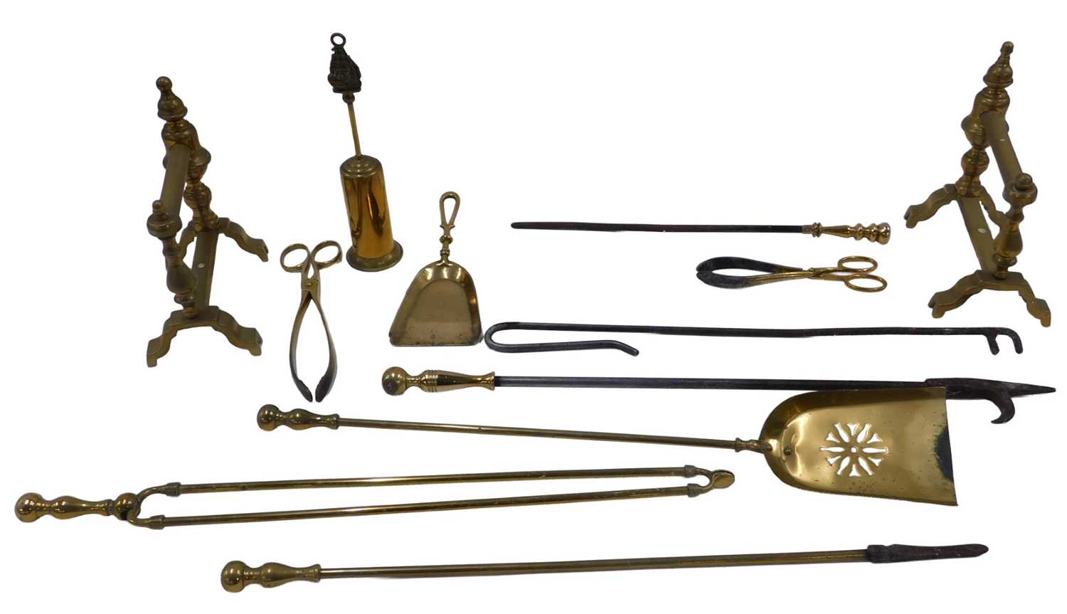 Lot 1048 - A collection of brass fire irons, fire dogs,