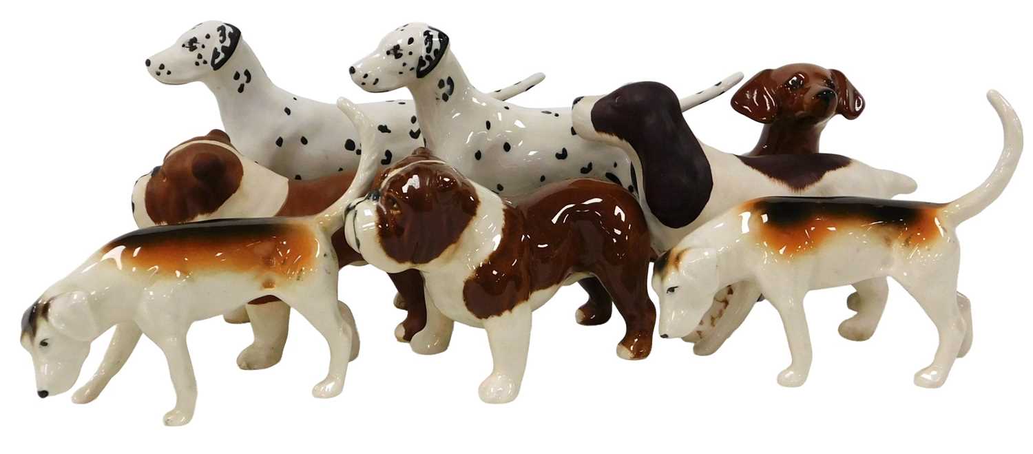 Lot 140 - A group of Beswick pottery figures of dogs,